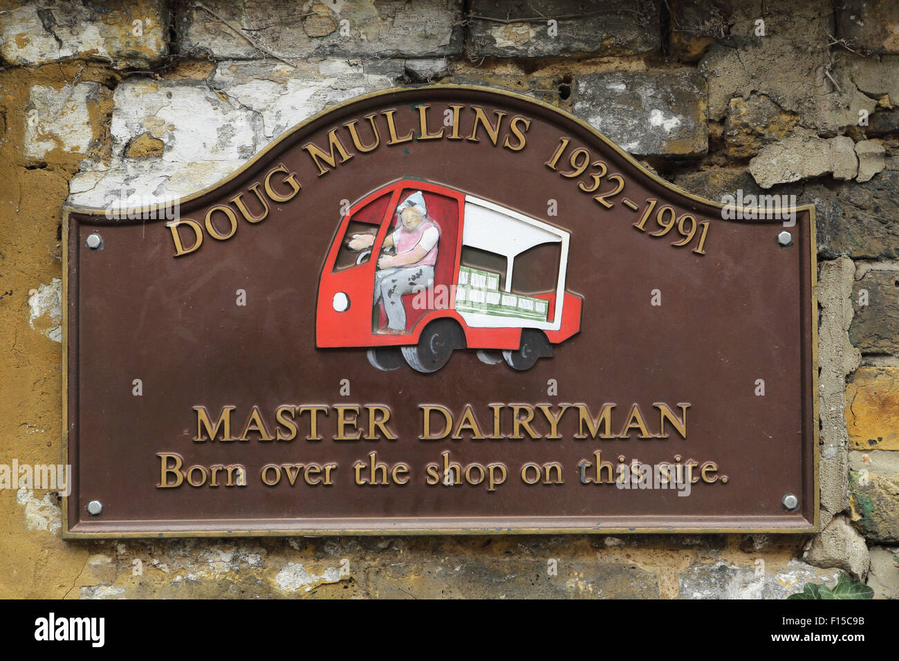A sign commemorates the life of Doug Mullins (1932 - 1991) in London ...