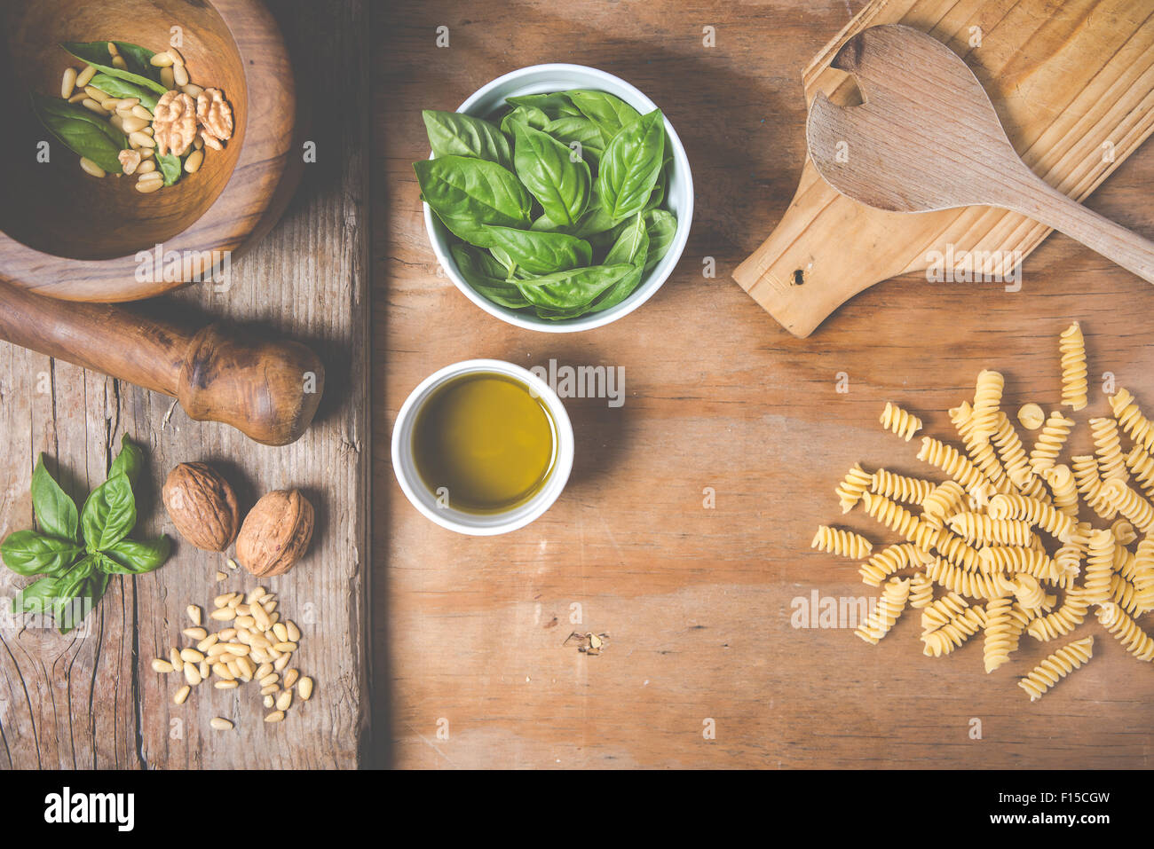Making pasta with pesto with the original recipe of Genova. Wooden ...