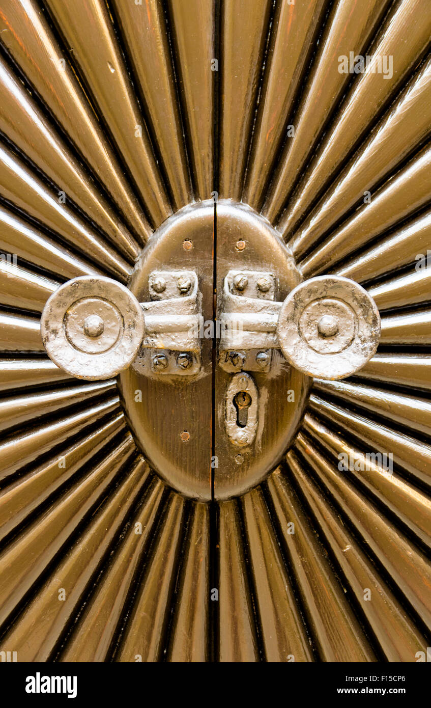 Metal door shaped sunburst with round handles Stock Photo - Alamy