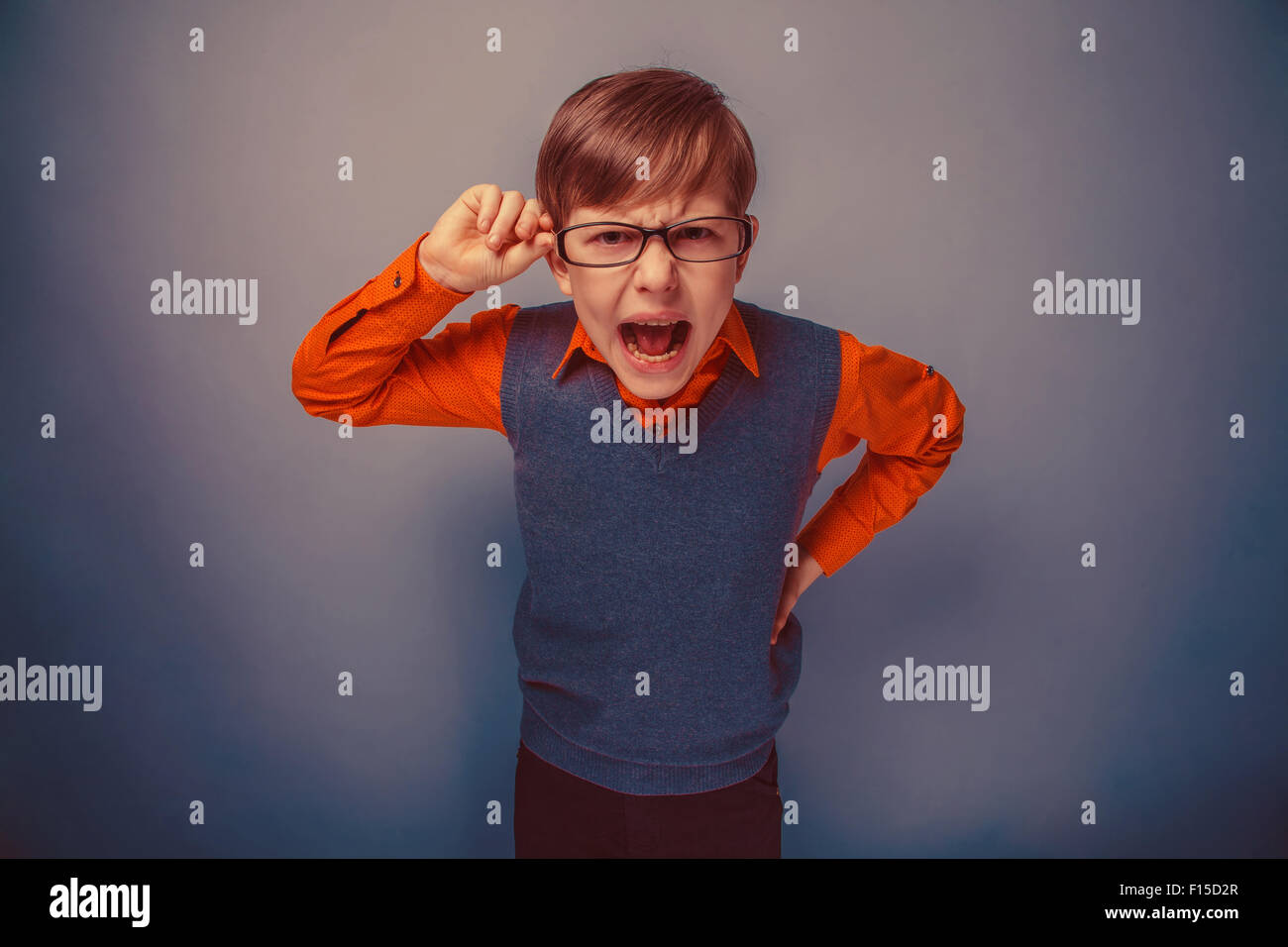 European-looking boy of ten years in glasses, anger, opened his Stock ...