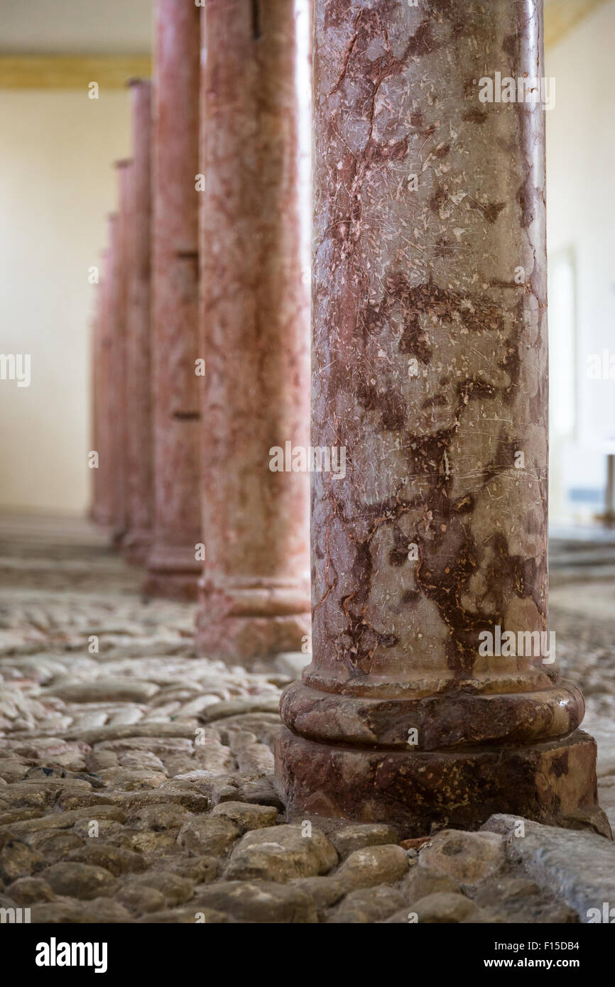 antique red marble columns resting on stone floor Stock Photo - Alamy