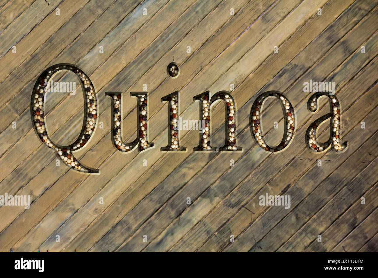 Text engraving word quinoa with quinoa grains filling up the engraving ...