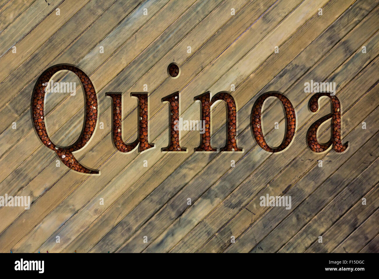 Text engraving word quinoa with quinoa grains filling up the engraving ...