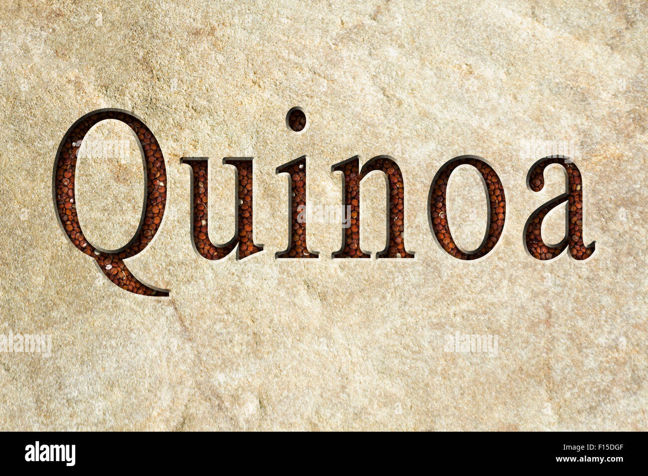 Text engraving word quinoa with quinoa grains filling up the engraving ...