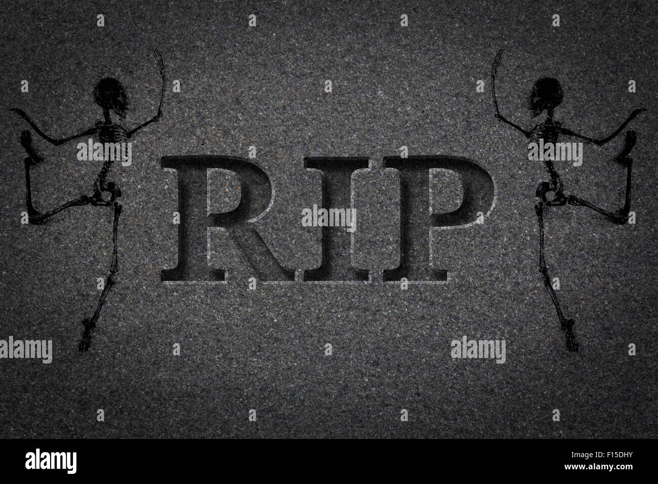 Engraved headstone spelling the letters RIP with Skeletons - rest in ...