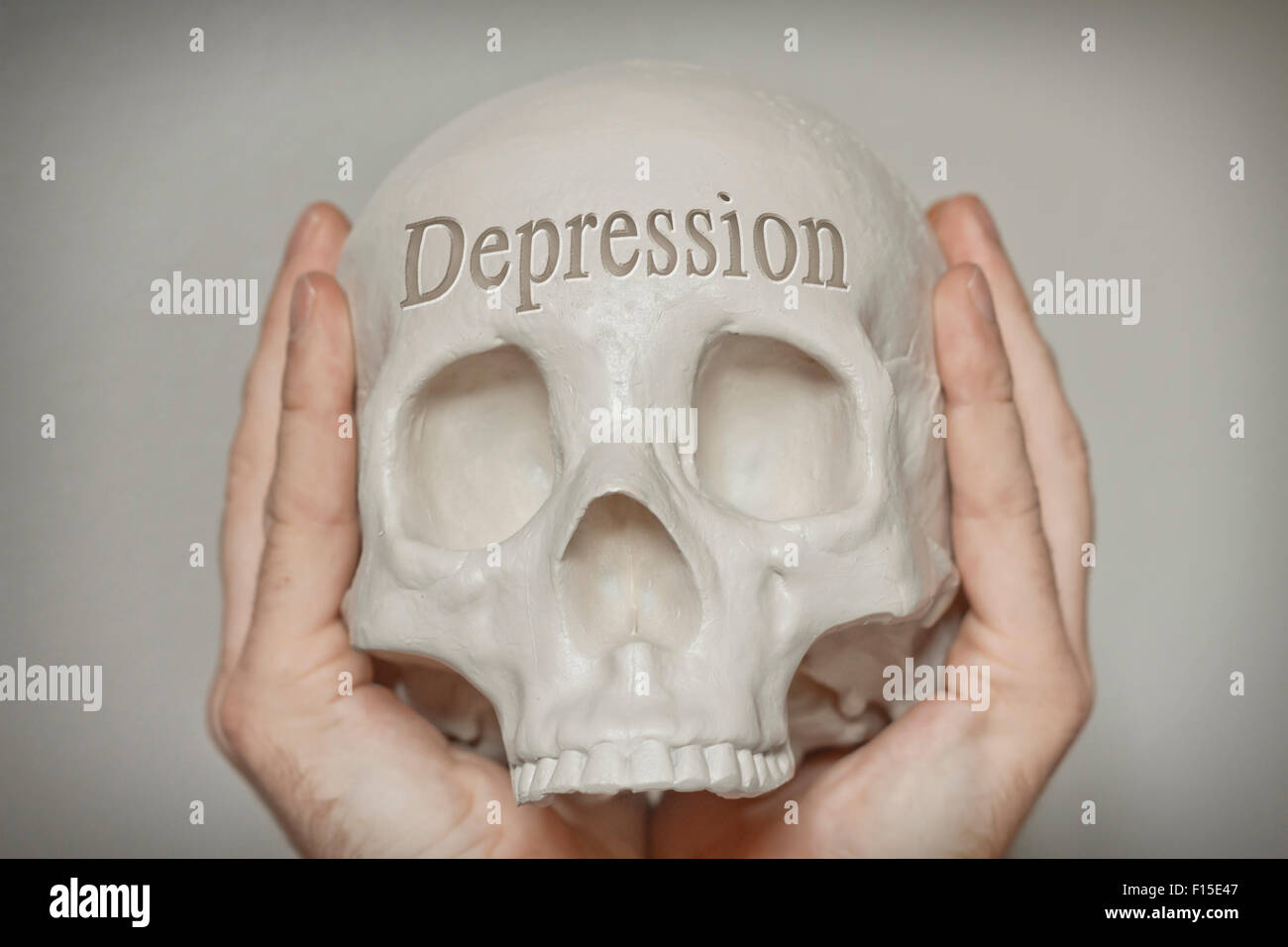 Engraved word Depression on held skull for conceptual image Stock Photo ...