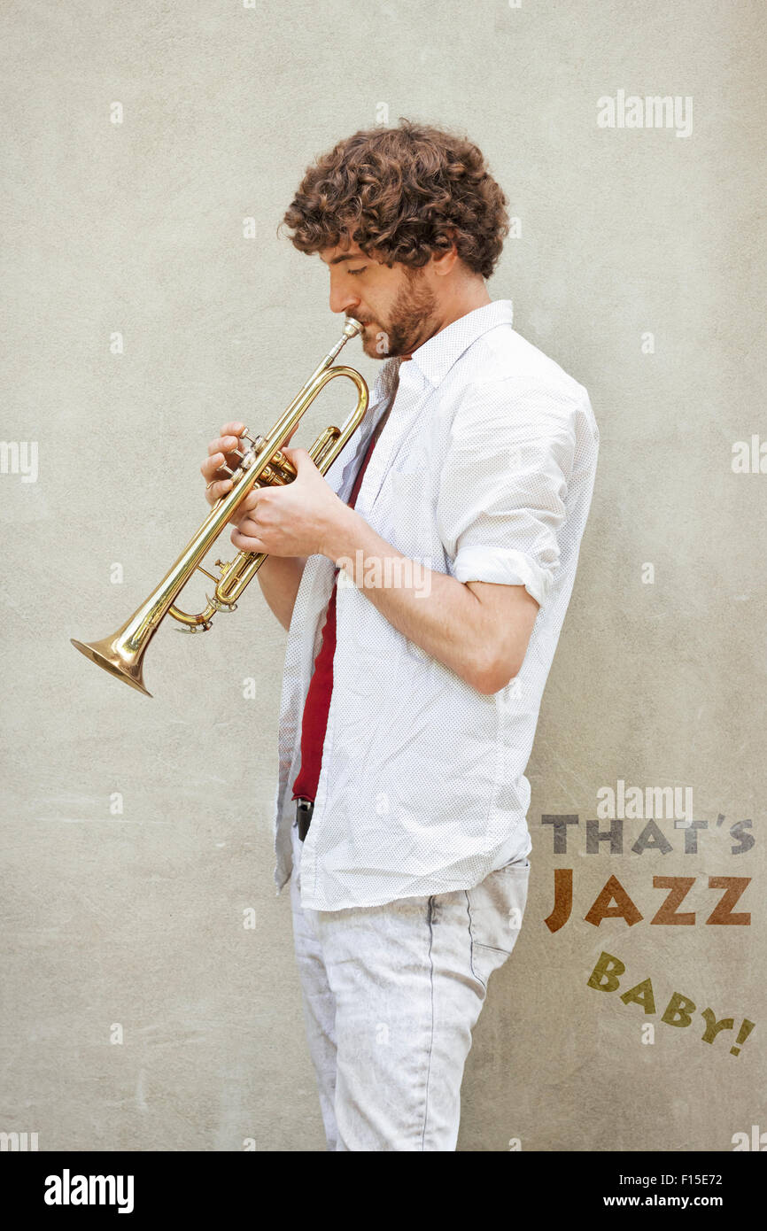 Curly haired man plays jazz trumpet outside Stock Photo - Alamy