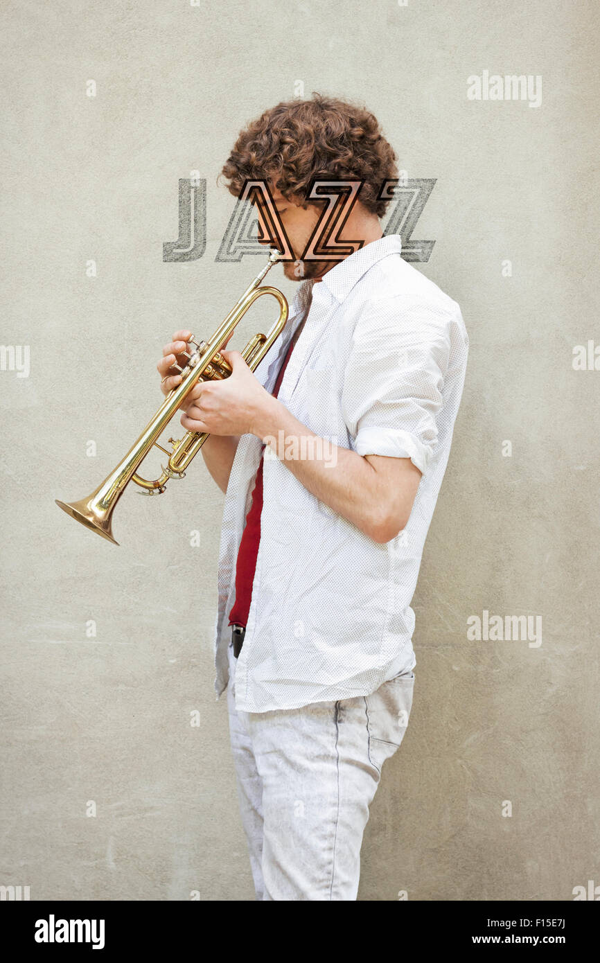 Curly haired man plays jazz trumpet outside Stock Photo - Alamy