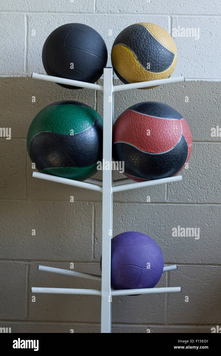 Weight balls on stand in gym for exercise and fitness Stock Photo - Alamy