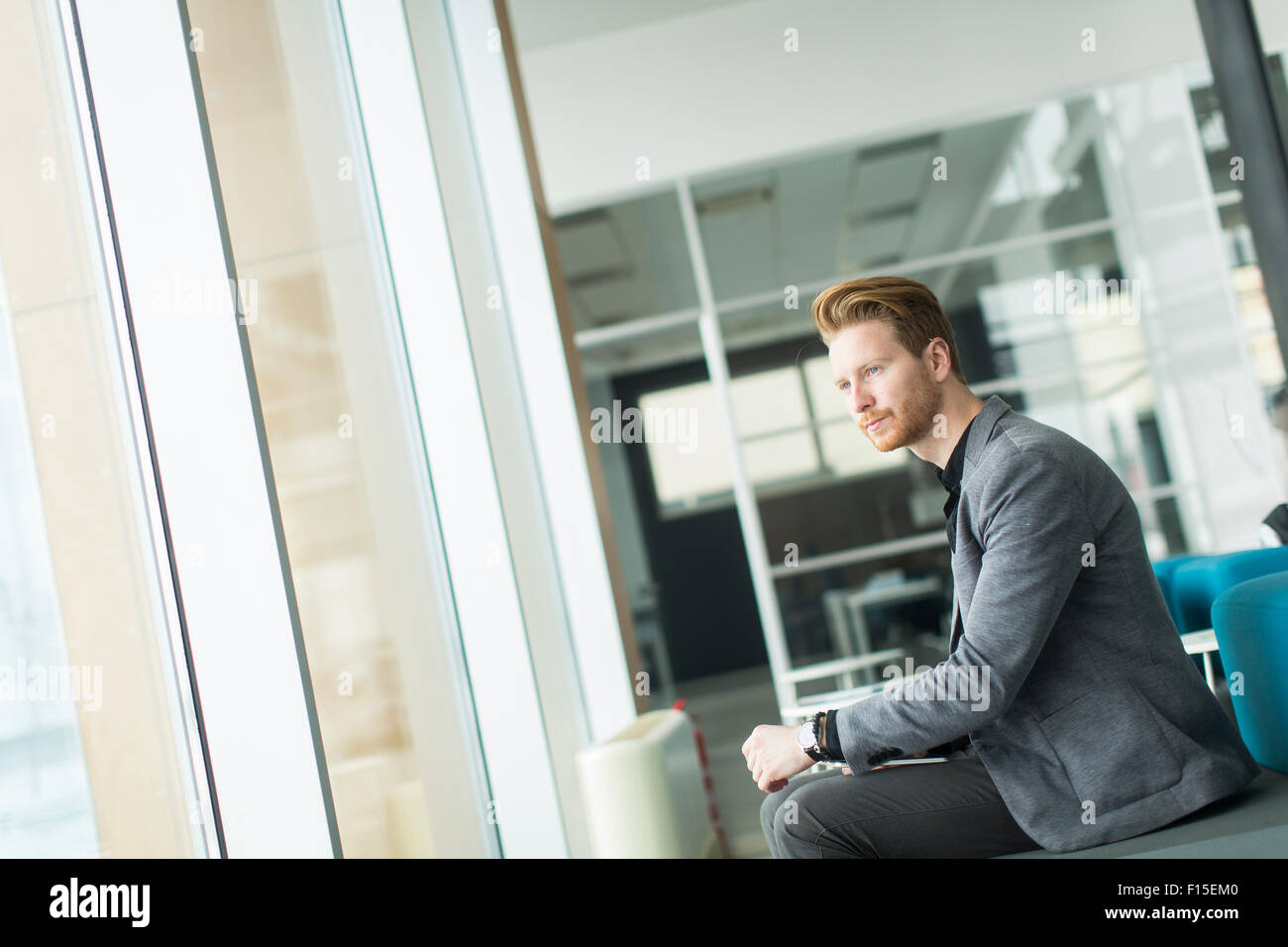 Young man in the office Stock Photo - Alamy