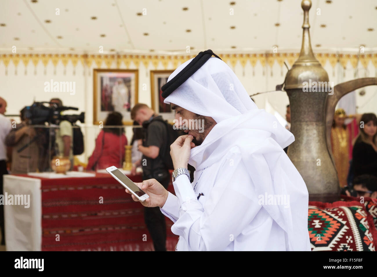 Arab man reading text on mobile phone, cell phone. Arabian people Stock ...