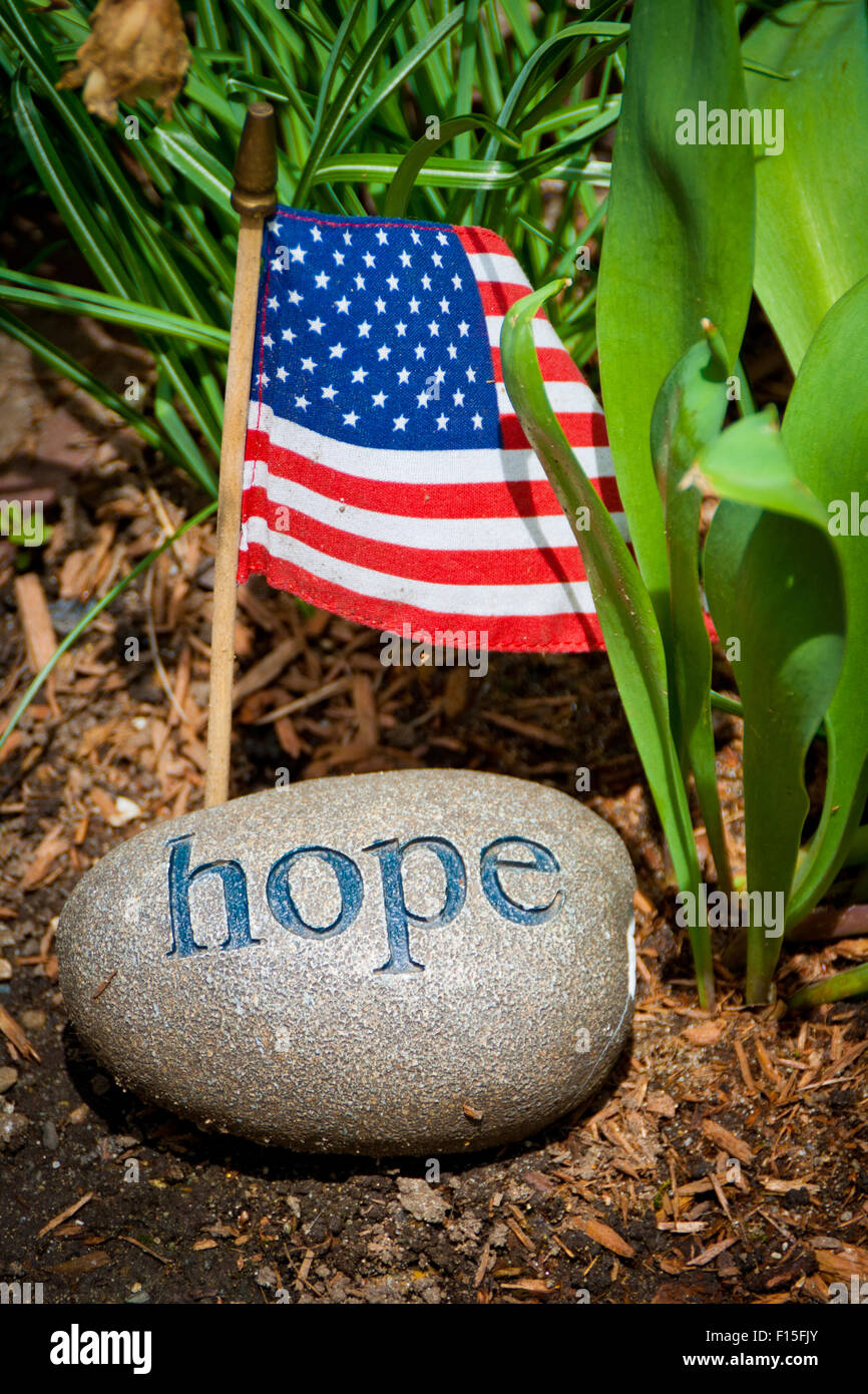 Hope message, carved on stone with USA flag Stock Photo - Alamy