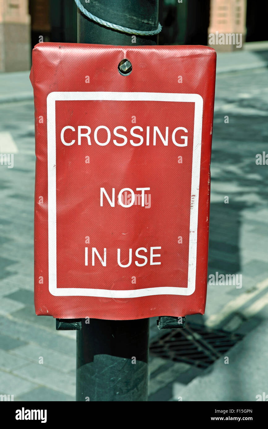 Crossings not in use sign Stock Photo - Alamy