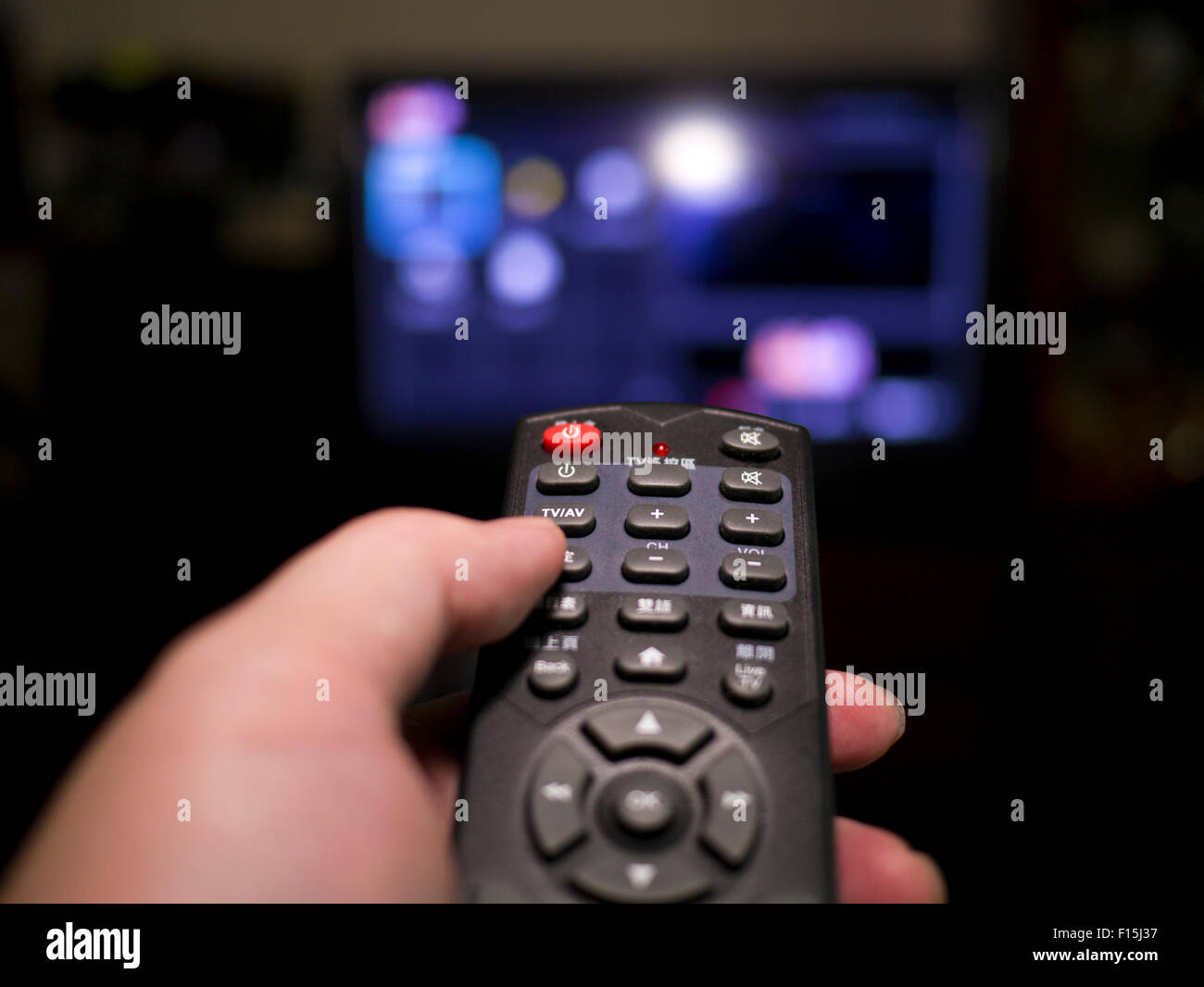 Person using remote control hi-res stock photography and images - Alamy