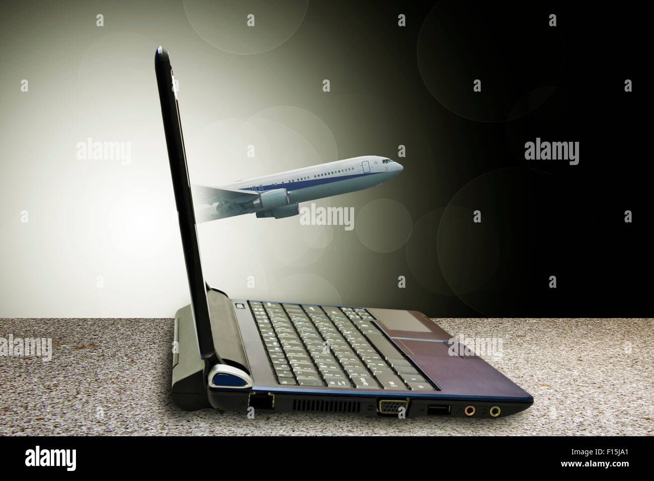 airplane through laptop,buy a travel with internet Stock Photo - Alamy
