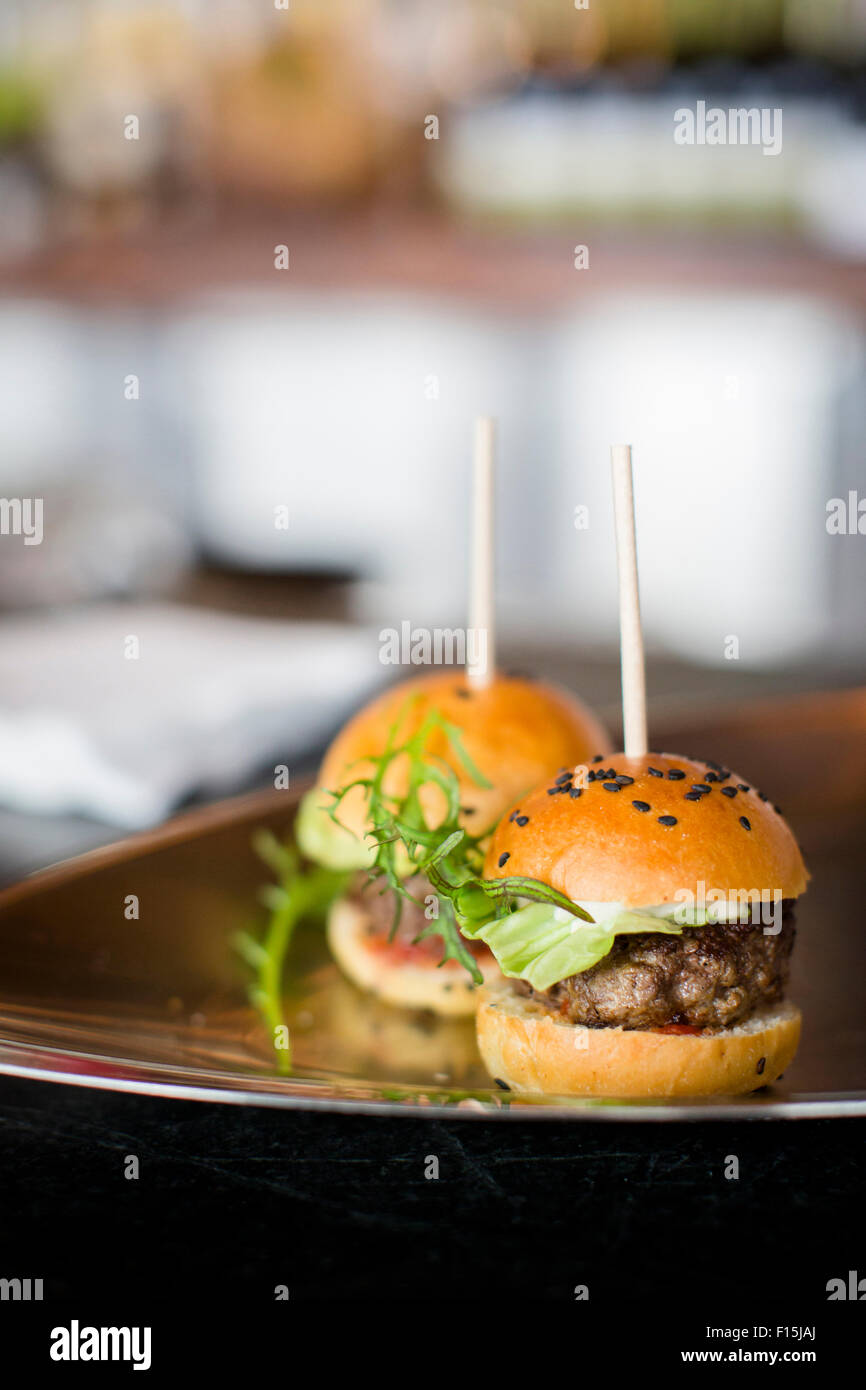 Mini Burger Sliders on Tray Stock Photo - Alamy
