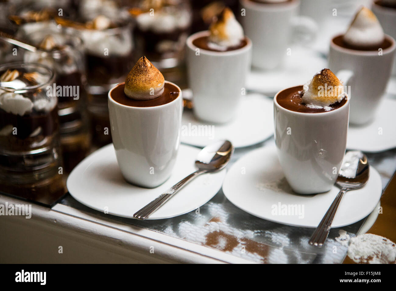 Mugs of Chocolate Mousse with Meringue on Dessert Table Stock Photo - Alamy