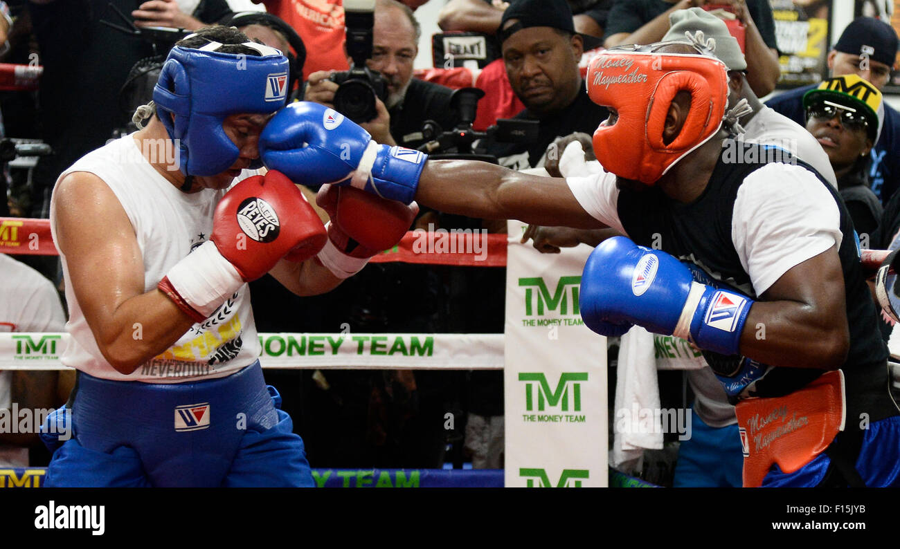Floyd Mayweather Jr.spars with some boxers during his media day workout ...