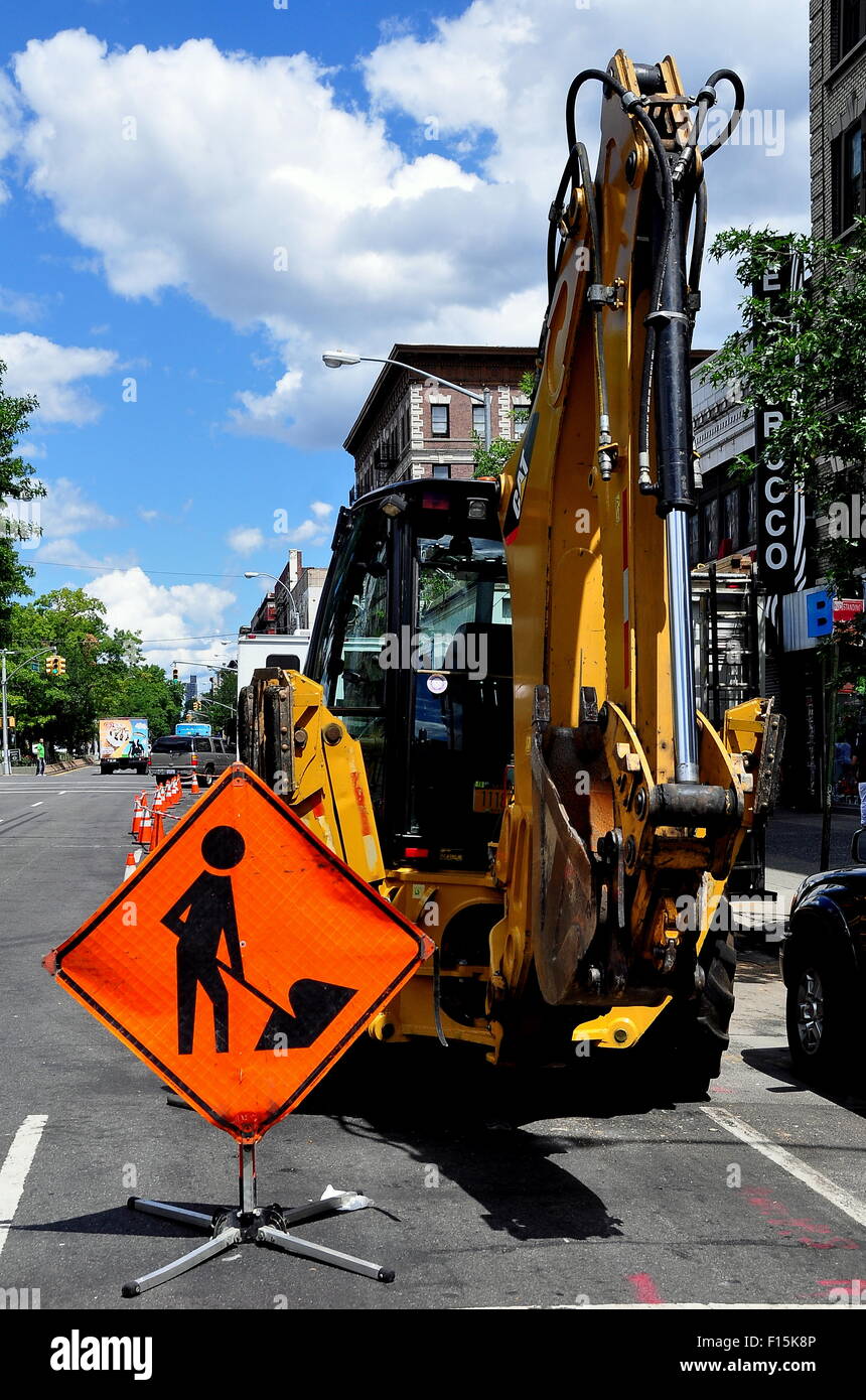 New York City: Orange men working sign and digging machine at a Con ...