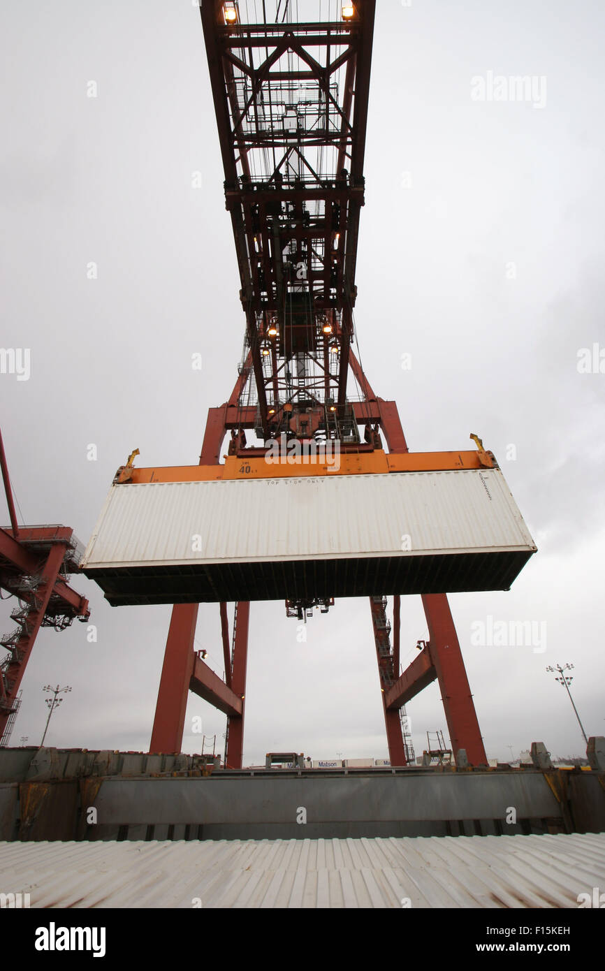 Shipping container being loaded aboard Stock Photo - Alamy