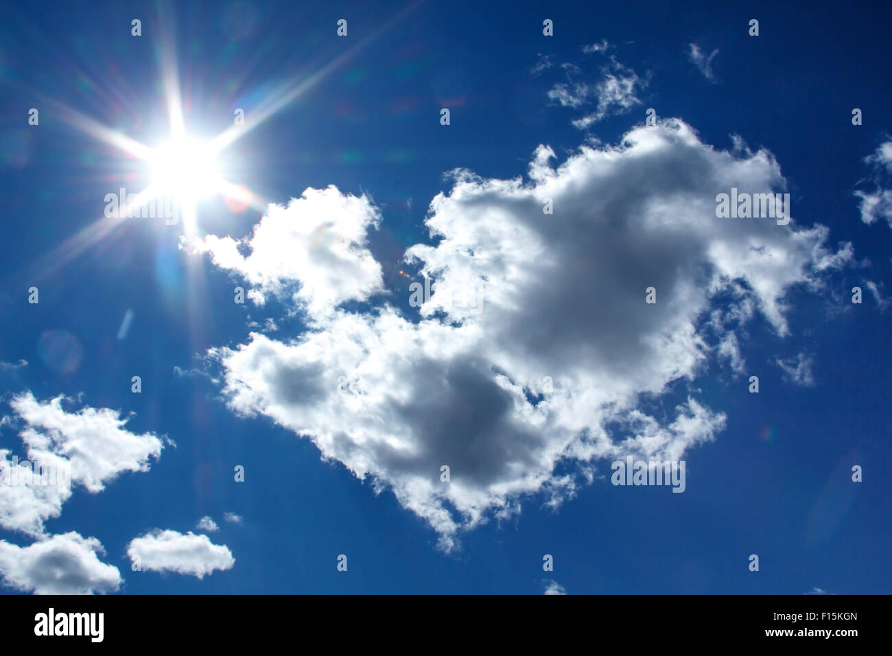 Sun in blue sky Stock Photo - Alamy