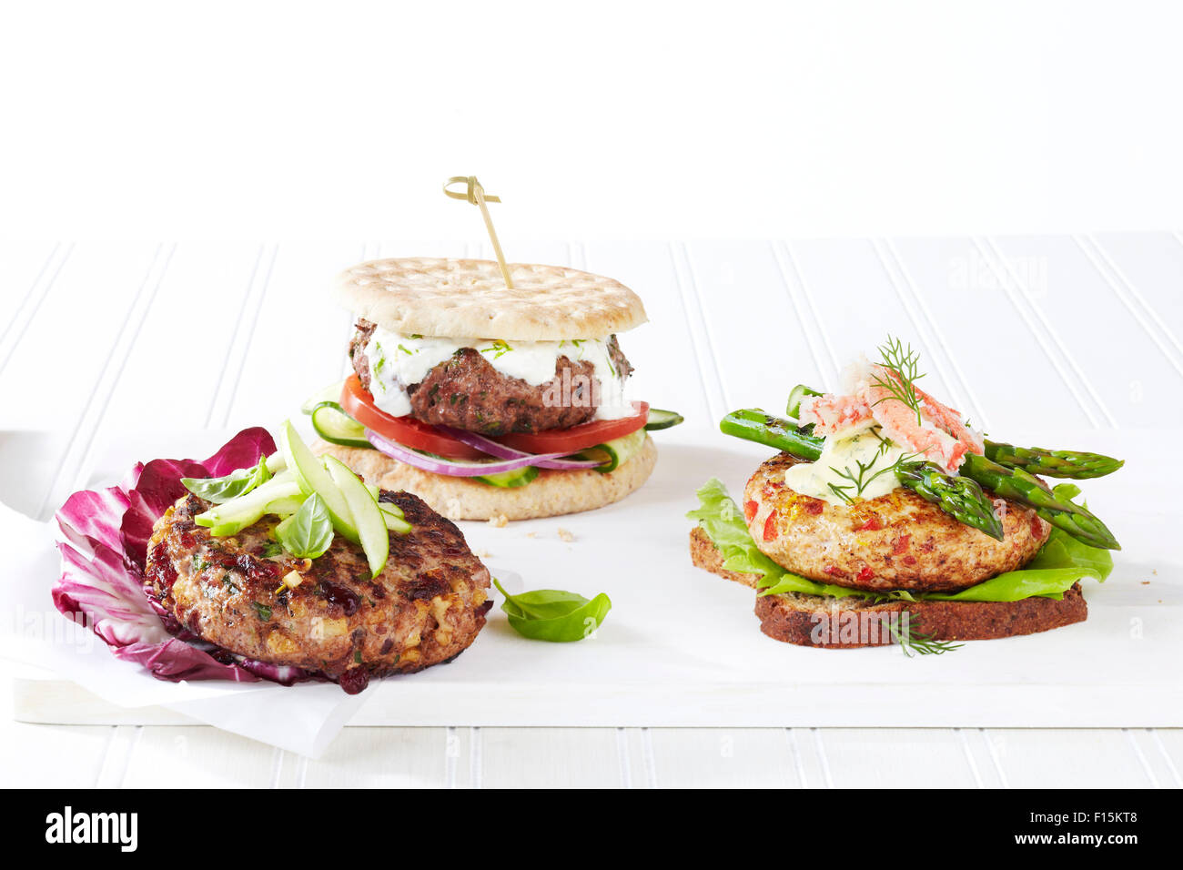 Three healthy hamburger options with different toppings, studio shot on ...