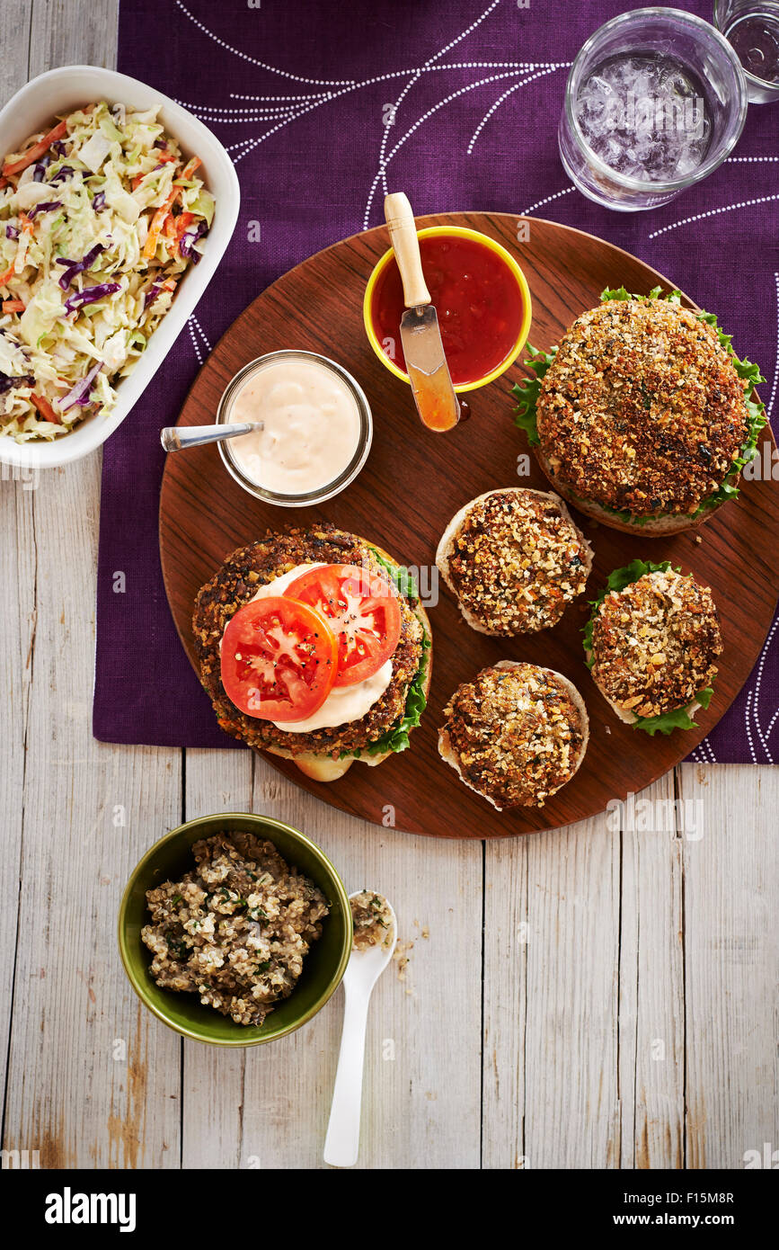 Vegetarian burgers on a platter with side dishes, studio shot Stock ...