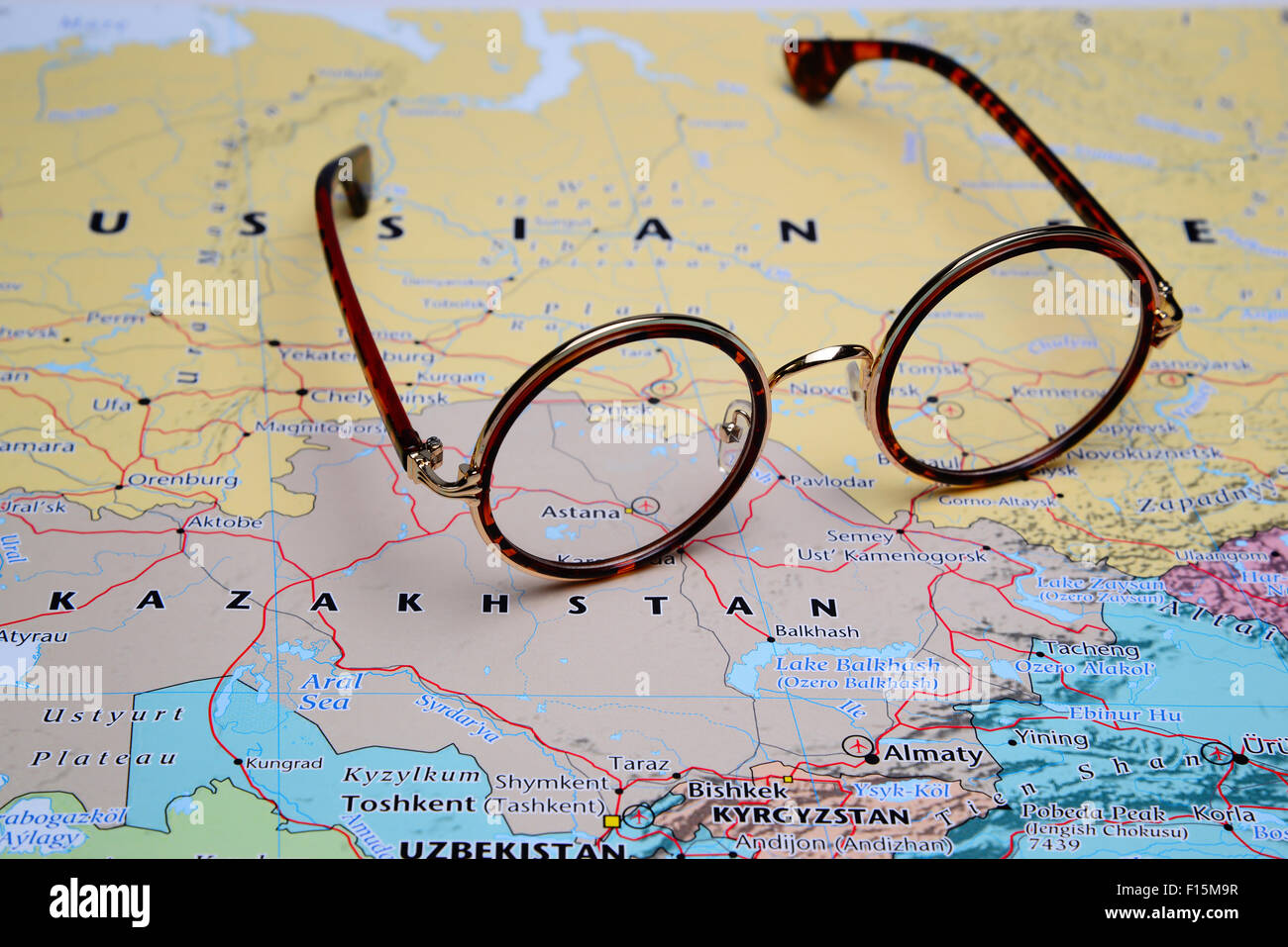 Glasses on a map of Asia - Astana Stock Photo - Alamy