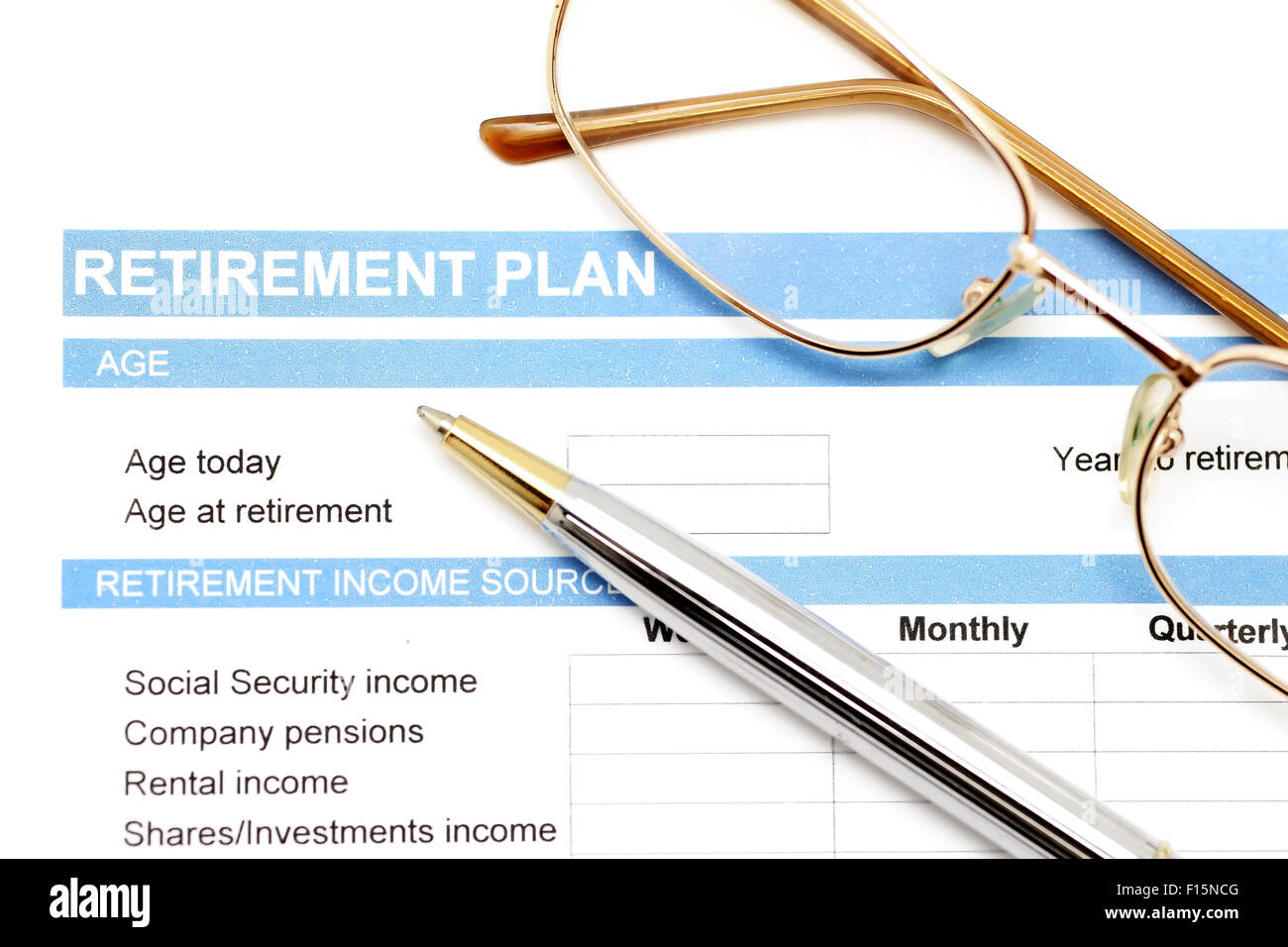 retirement plan document with pen and eye glasses Stock Photo - Alamy