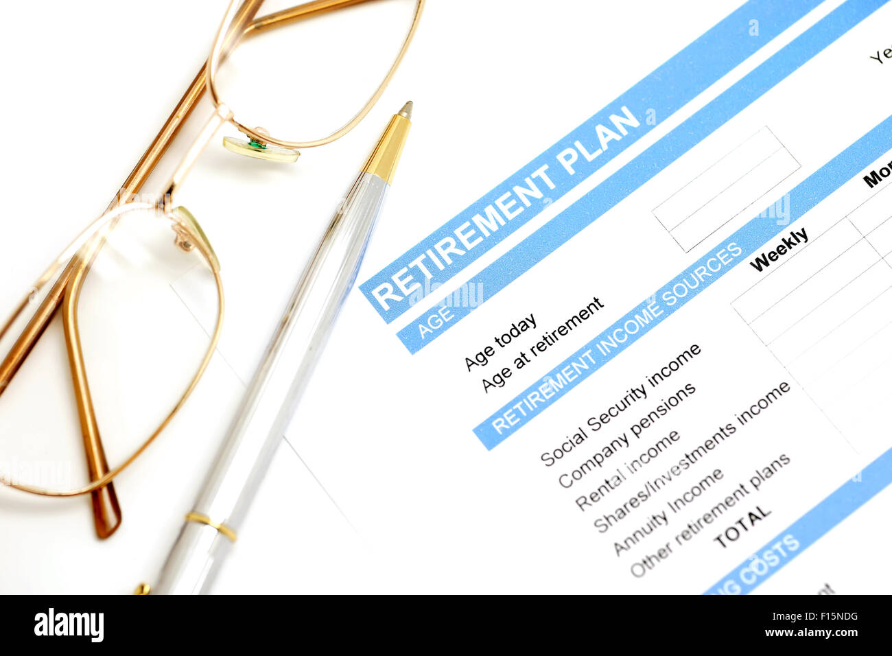 retirement plan document with pen and eye glasses Stock Photo - Alamy