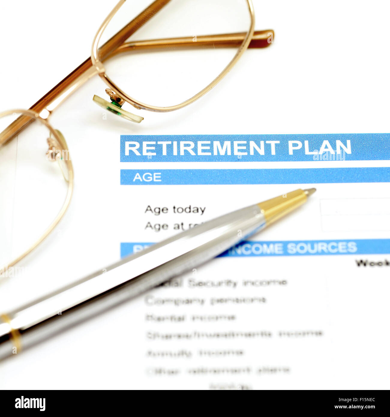 retirement plan document with pen and eye glasses Stock Photo - Alamy