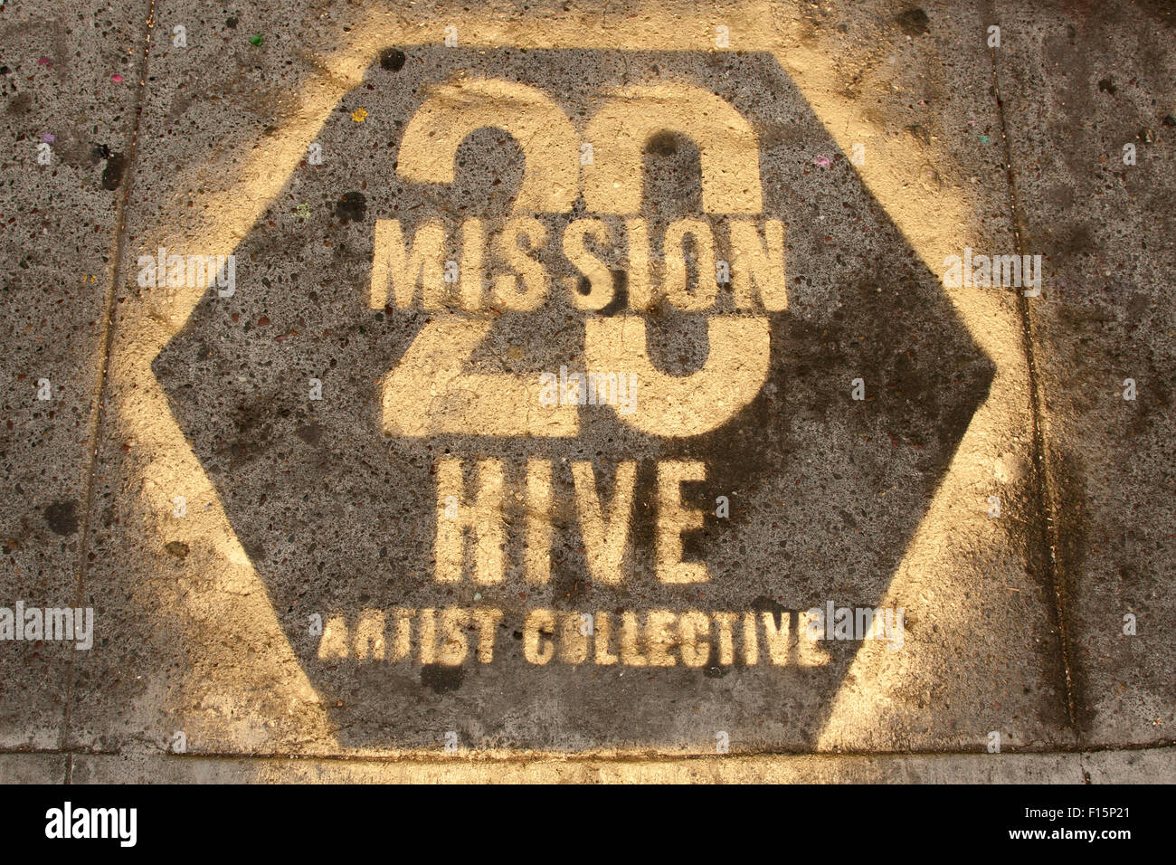 The Hive Artist Collective, sign painted on the sidewalk outside the ...