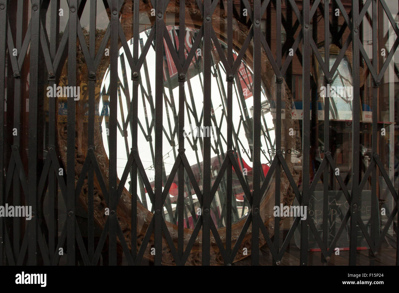 Antique mirror behind a shop window gate on Mission Street, in The ...