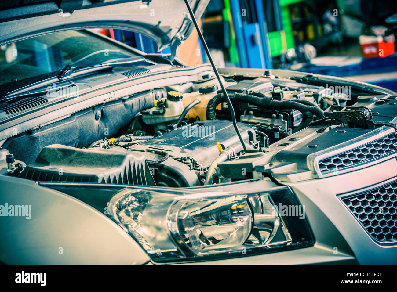 Car Repairing. Modern Compact Car with Open Hood. Car Under Maintenance ...