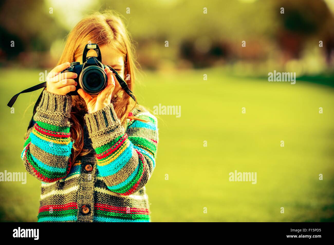 Caucasian Girl with Large Modern DSLR Camera Taking Pictures in Park ...