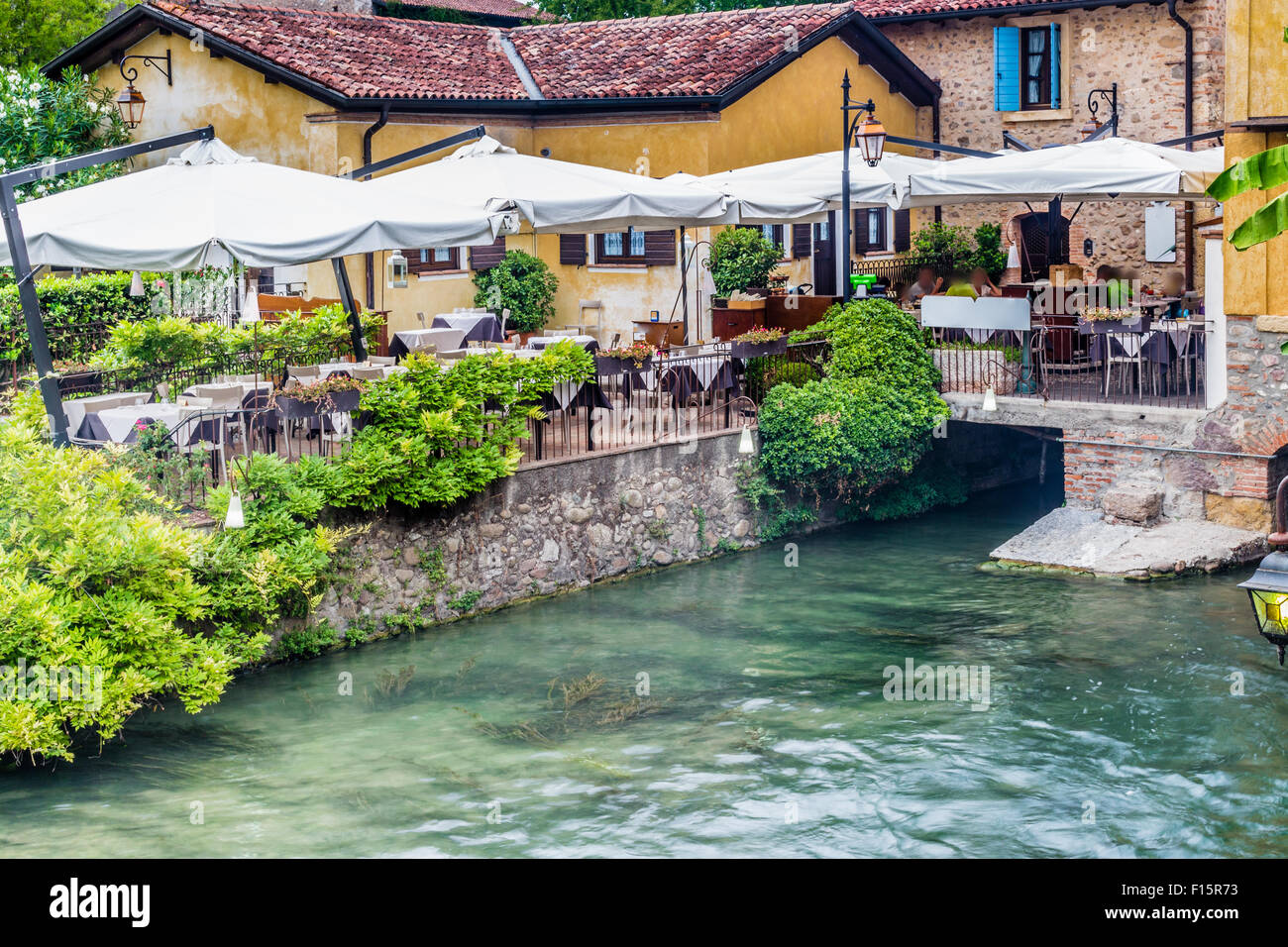 ancient restaurant of a typical Italian medieval village and water: the ...