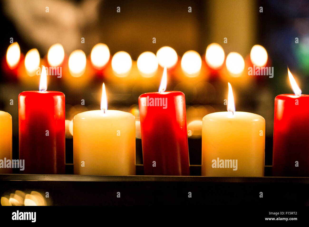 Close-up of Red and White Lit Candles Stock Photo - Alamy