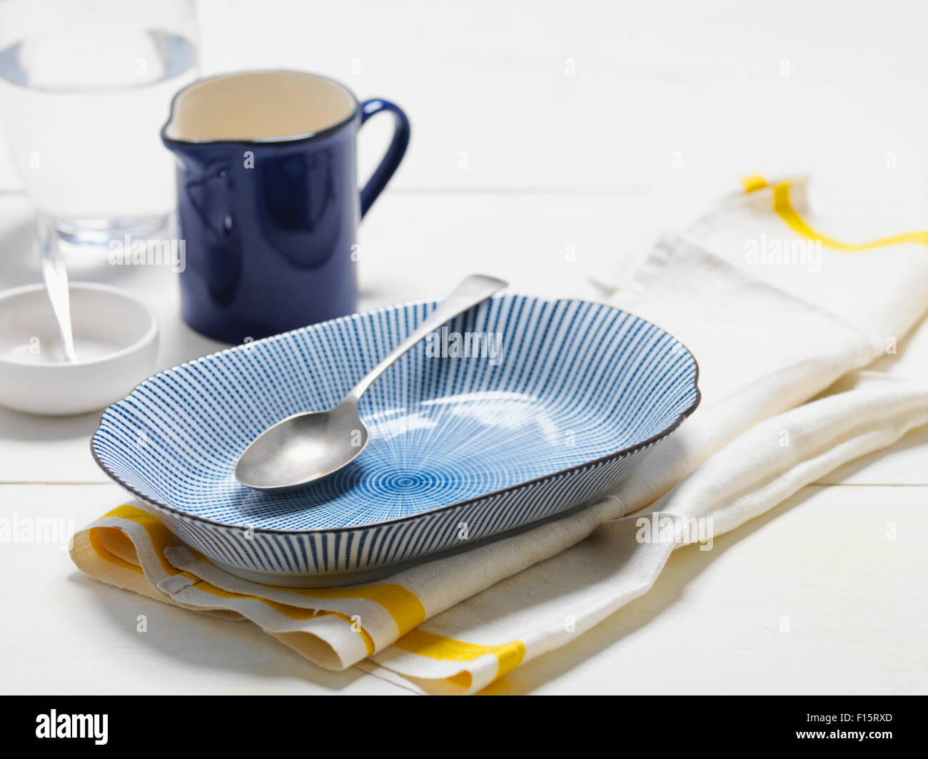 Close-up of Spoon in Bowl and Pitcher, Studio Shot Stock Photo - Alamy