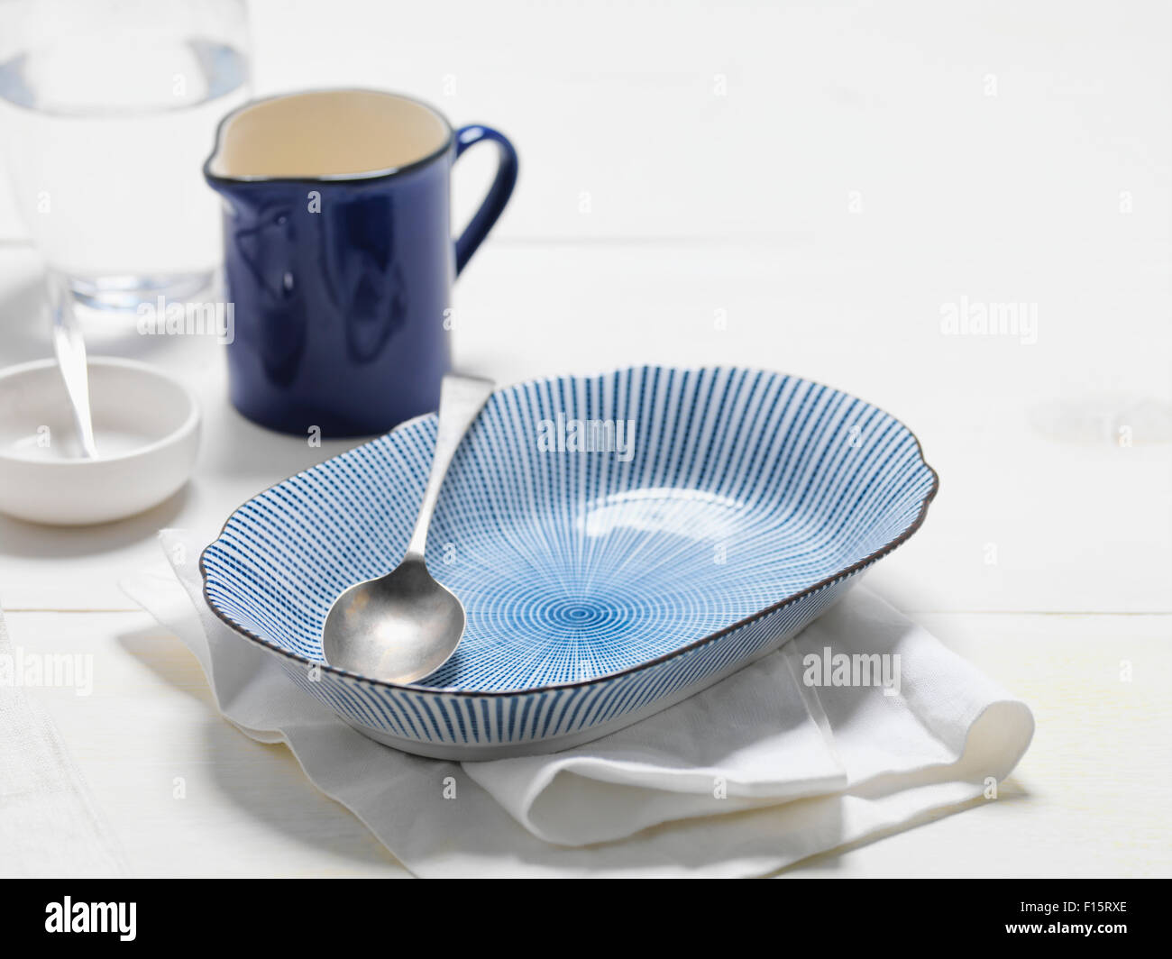 Close-up of Spoon in Bowl and Pitcher, Studio Shot Stock Photo - Alamy