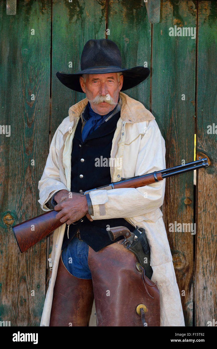 Cowboy with rifle hi-res stock photography and images - Alamy