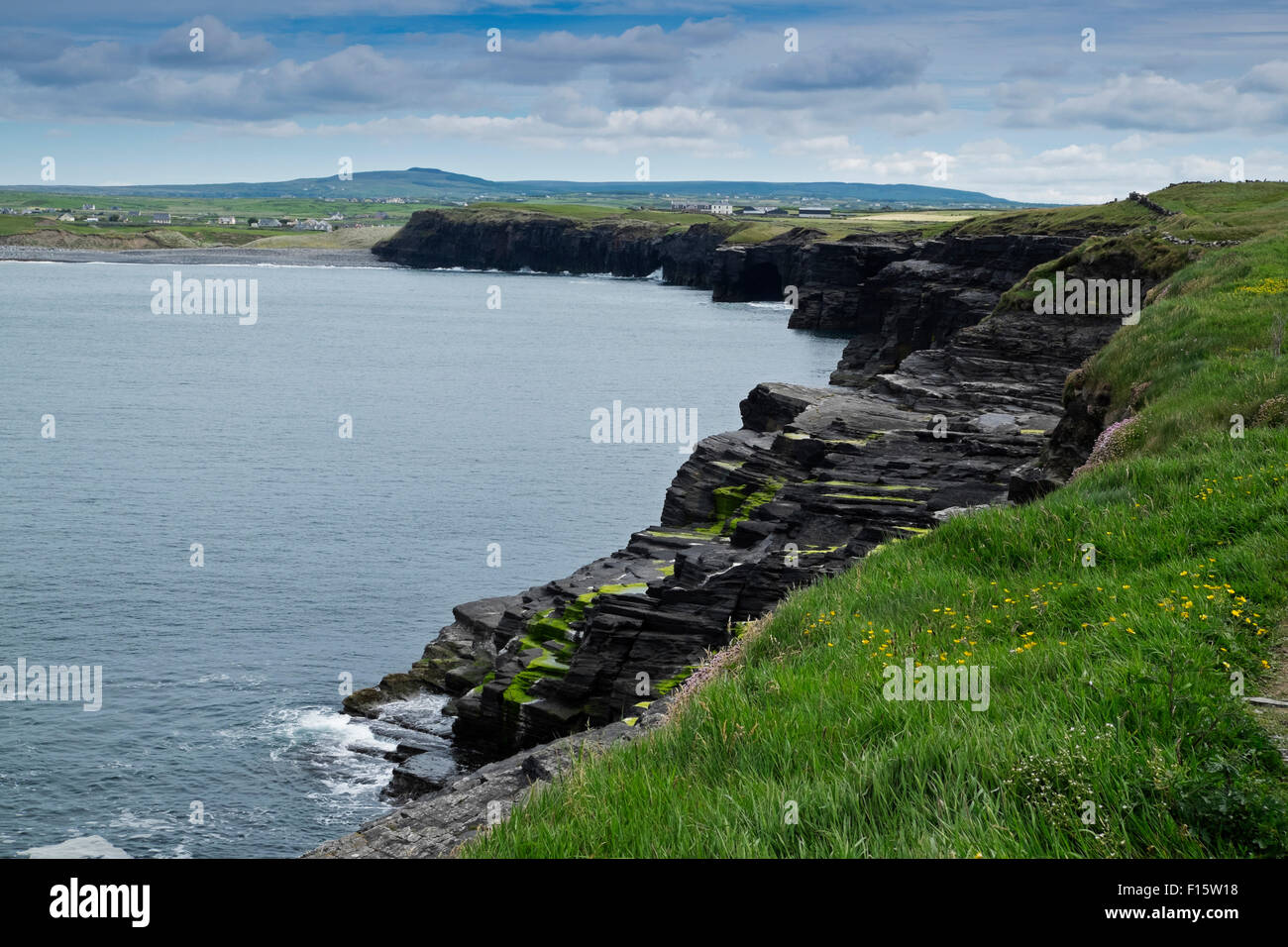 Trail to the Cliffs of Moher with the coastal village of Doolin in the ...