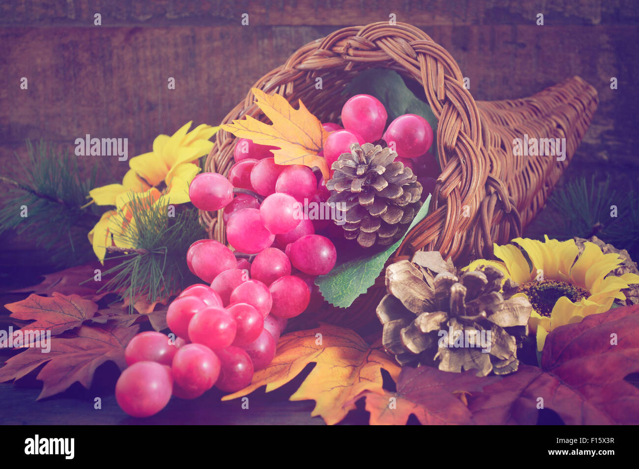 Autumn background with traditional Thanksgiving cornucopia on dark wood ...