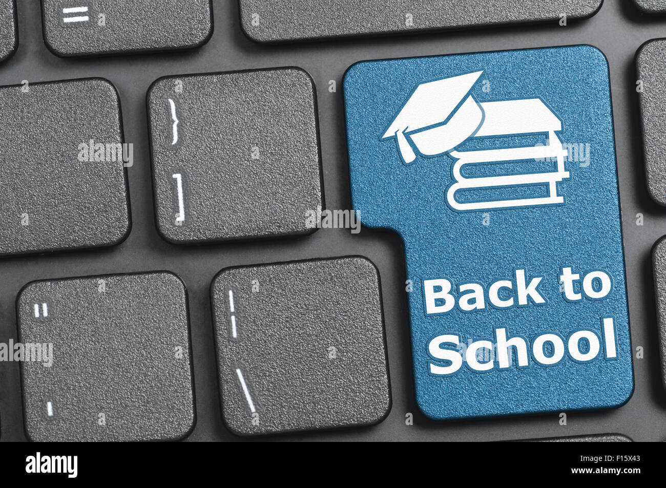 Blue back to school key on keyboard Stock Photo - Alamy