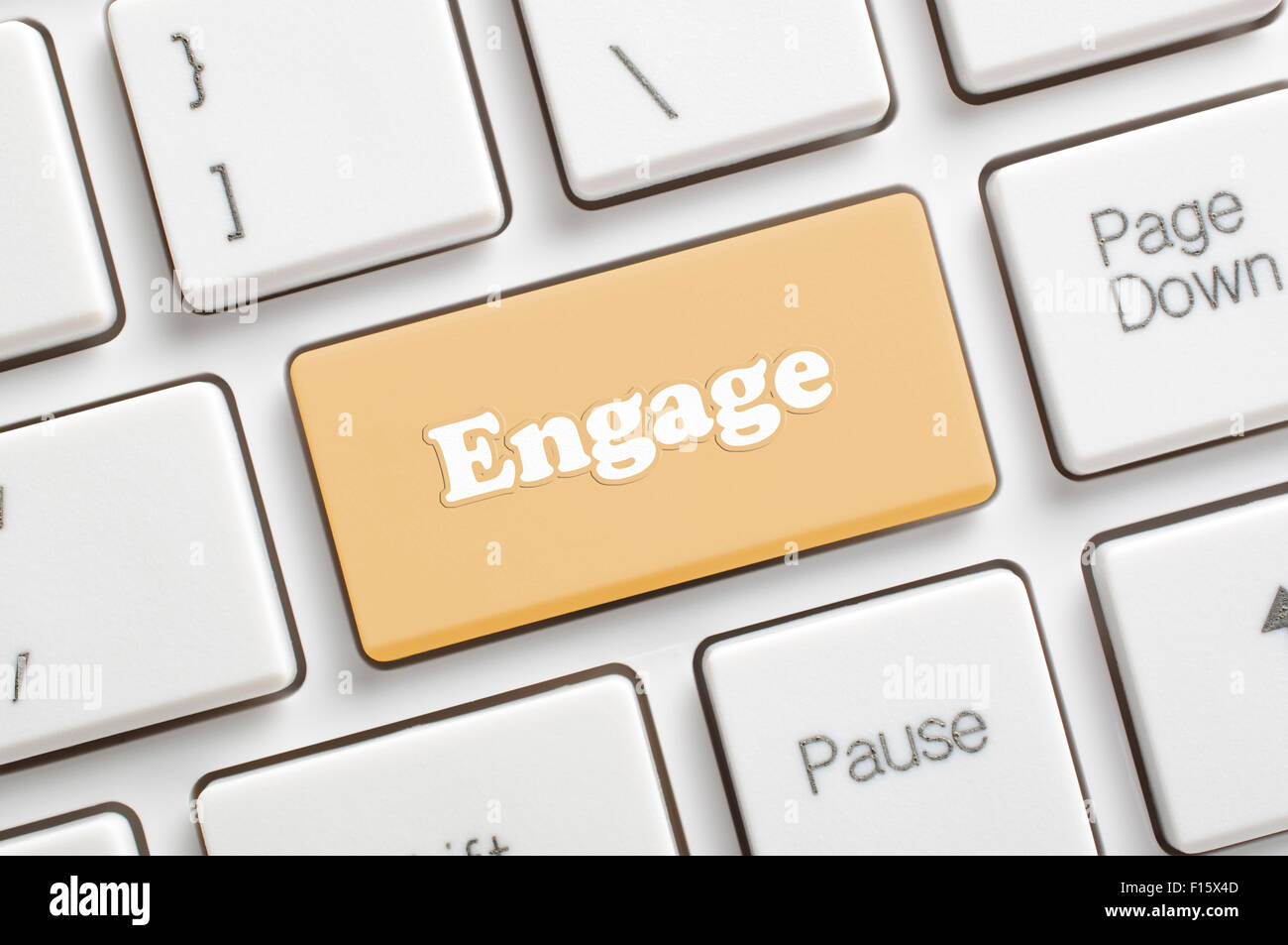 Brown engage key on keyboard Stock Photo - Alamy