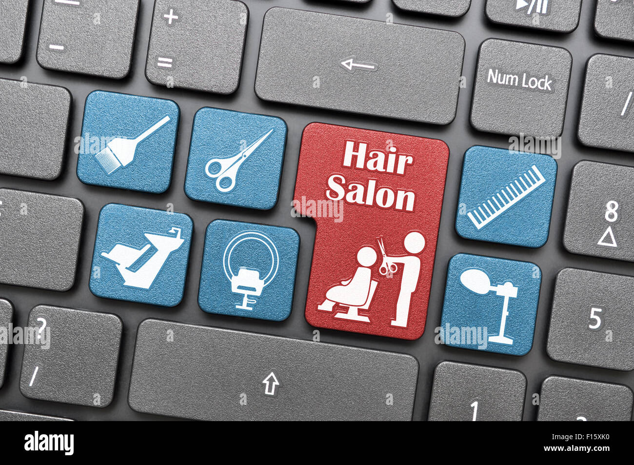 Red and blue hair salon key on keyboard Stock Photo - Alamy
