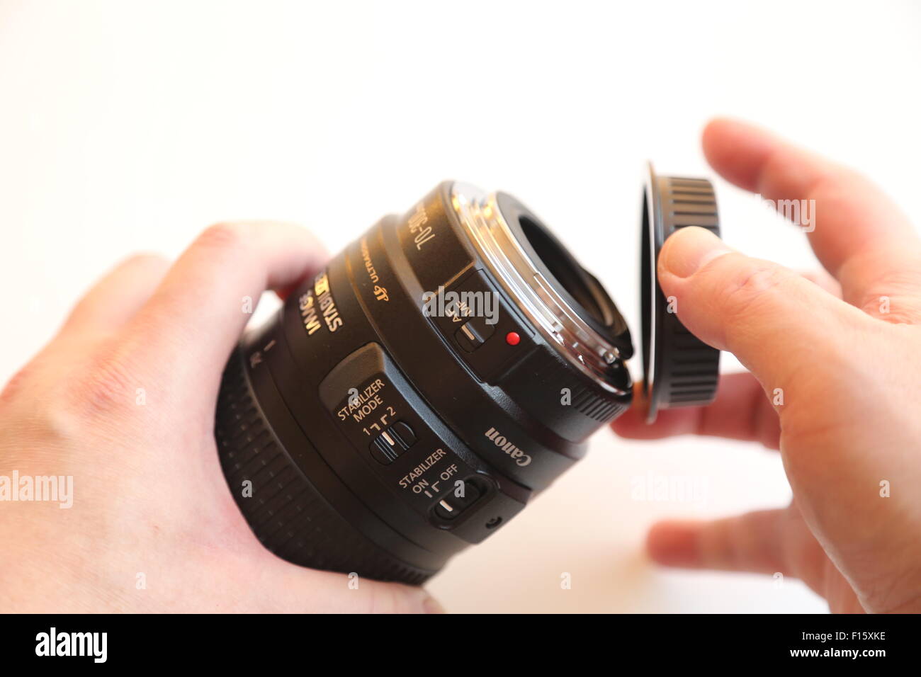 Hand on camera lens hi-res stock photography and images - Alamy