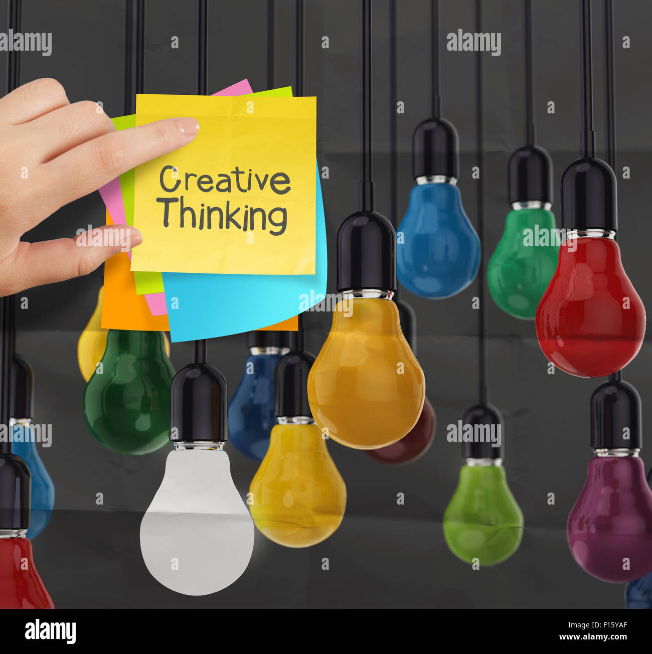 sticky note with creative thinking word light bulb on crumpled paper as ...