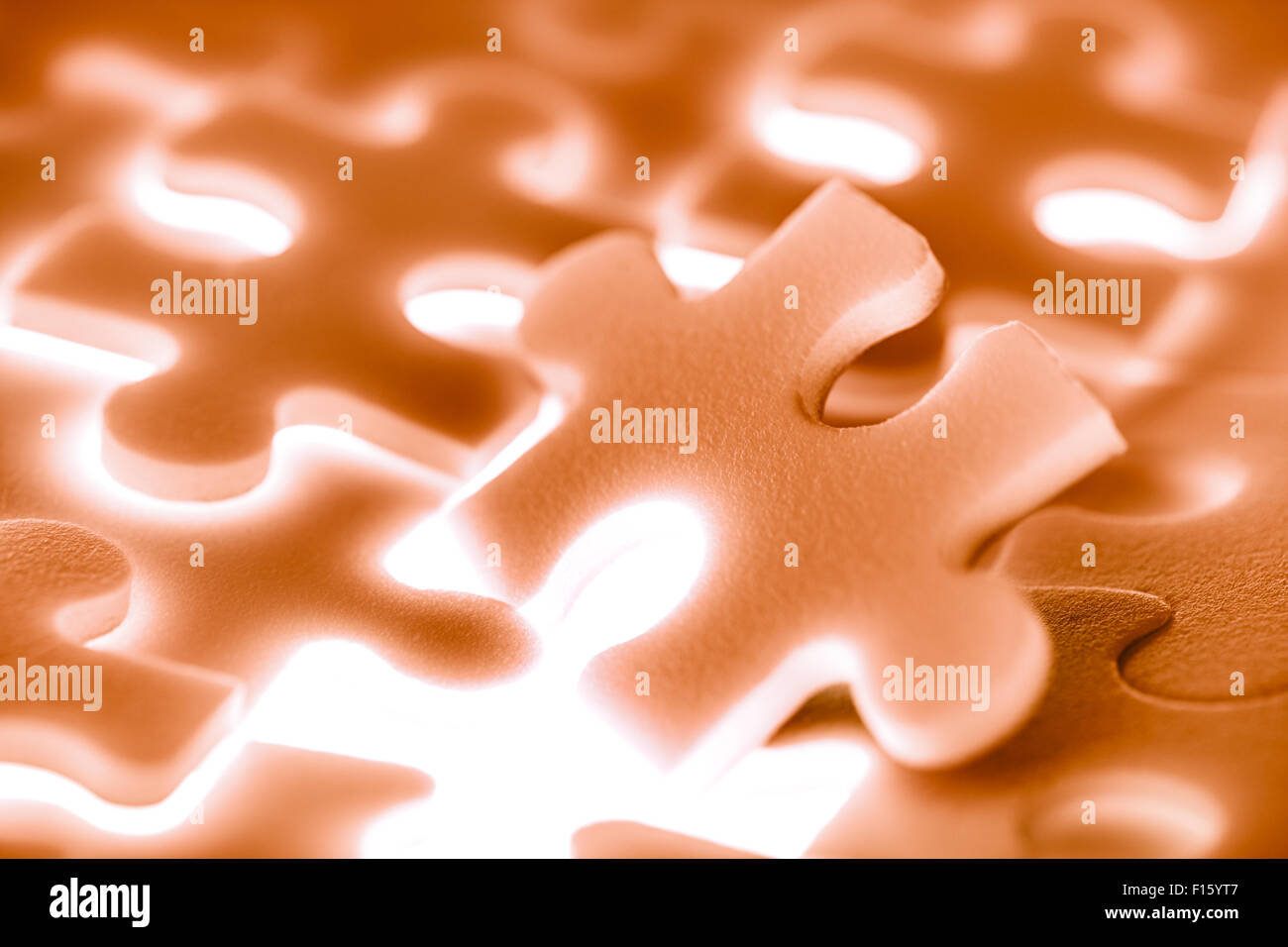 Background of large shining puzzles in brown Stock Photo - Alamy