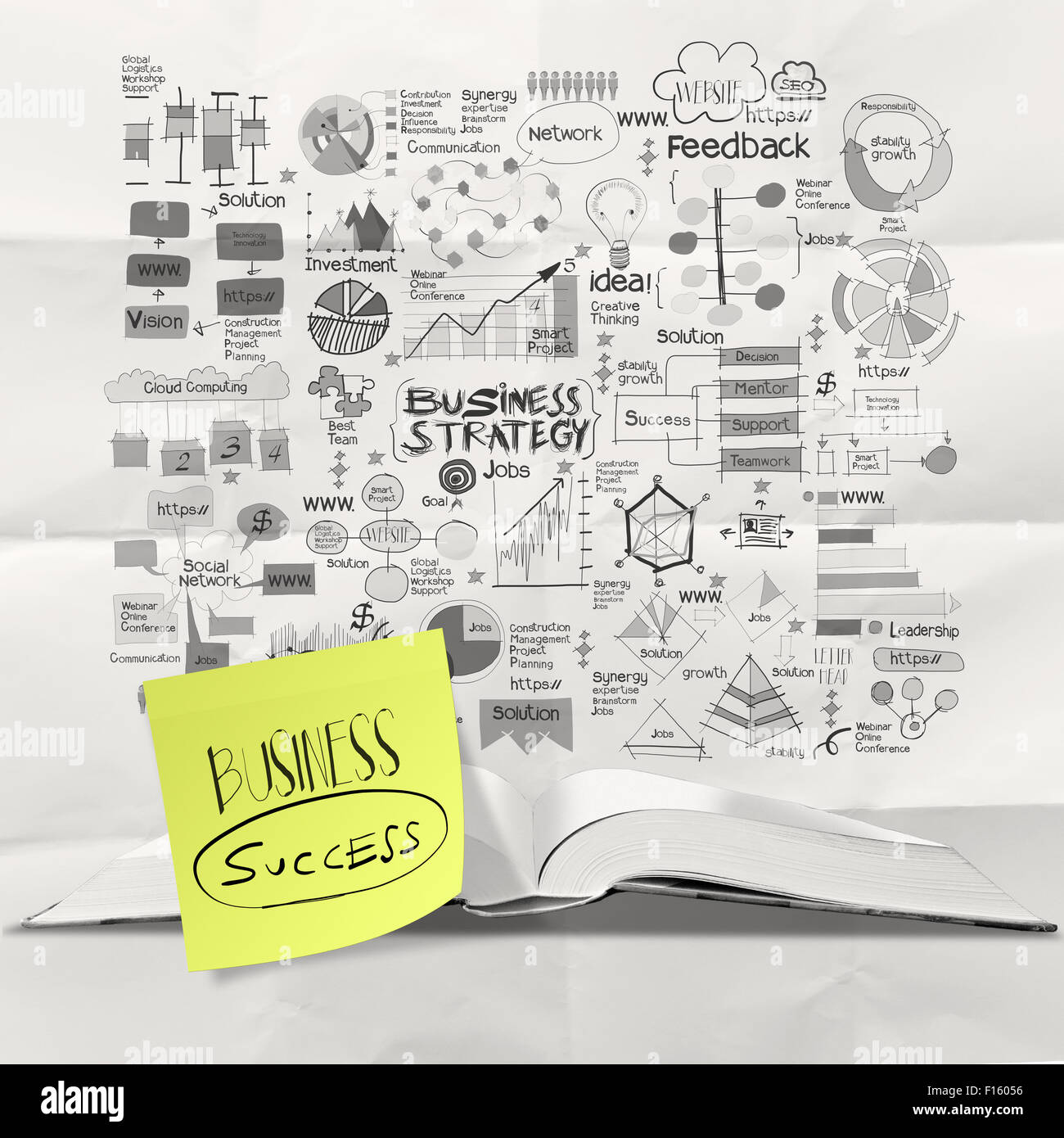 book of hand drawn business strategy on crumpled paper background as ...