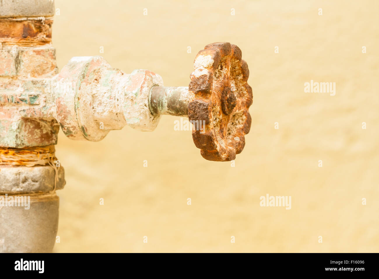 Closeup view of a gate valve that is covered with rust Stock Photo - Alamy